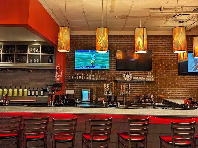 The bar area glows with pendant lights that look like flames&mdash;subtle foreshadowing for the flavor explosions about to happen.