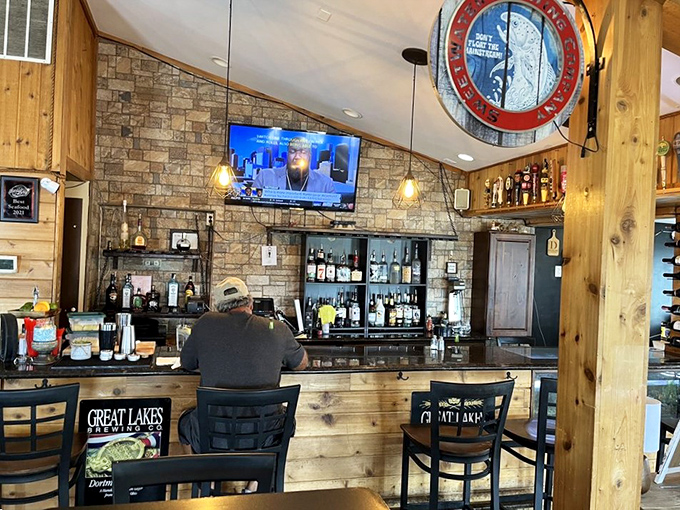 The bar area marries rustic charm with serious beverage credentials. Those Great Lakes Brewing chairs know they're in good company.