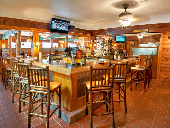 The bar area combines rustic wood, warm lighting, and enough spirits to make you forget you have to drive home eventually.