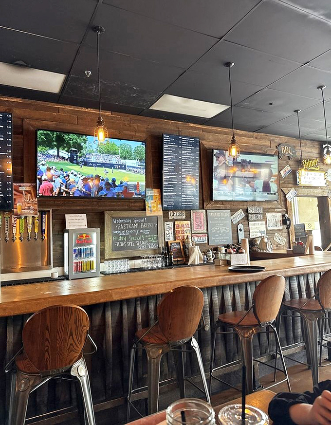 The bar area beckons with rustic charm and the promise of cold drinks to complement hot barbecue.