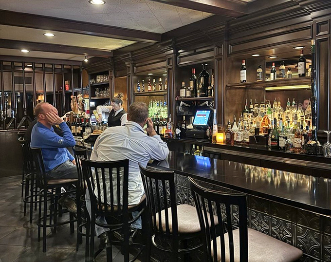 The bar at Charlie Gitto's &ndash; where strangers become friends and friends become family, one perfectly mixed cocktail at a time.