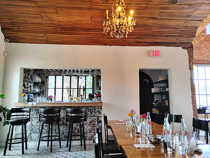 The bar area whispers "stay awhile" with its warm wood tones and elegant chandelier&mdash;a perfect perch for people-watching or tequila-sipping.