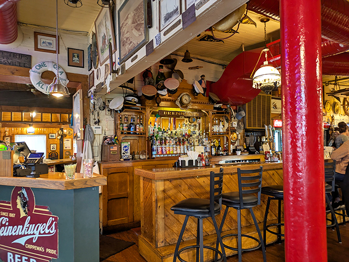 The bar area looks like it was designed by a sea captain with excellent taste. Those hanging nautical artifacts have witnessed countless toasts and celebrations.