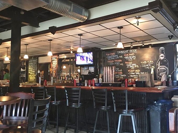 The bar area where hoppy conversations flow as freely as the carefully curated craft beer selection.