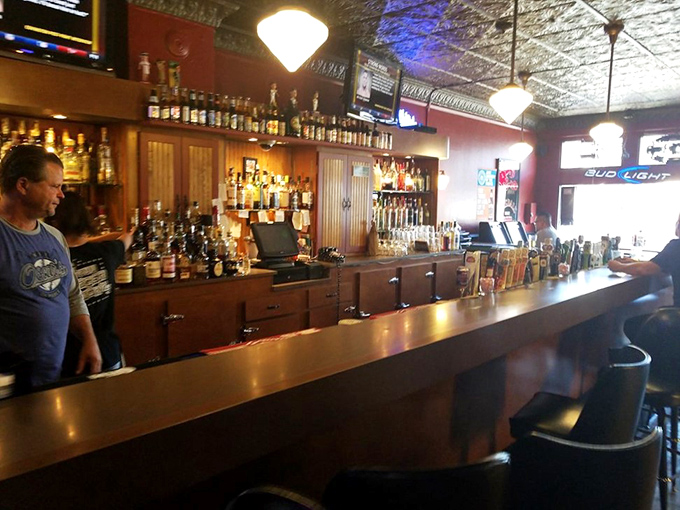 A bar that means business &ndash; with an impressive lineup of spirits, ornate ceiling tiles, and the promise of perfectly crafted drinks to accompany your meal.