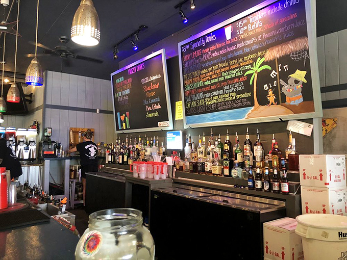 The bar's command center, where oyster magic happens and cold drinks flow like the tide.
