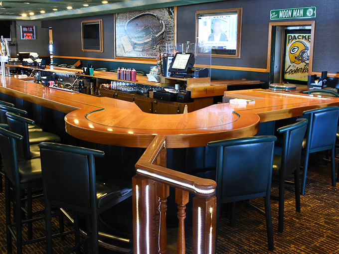 A bar crafted for serious sports watching, where the wood is polished by generations of elbows and the beer flows like victory.