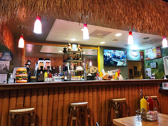 The tiki bar atmosphere meets craft beer selection in this surprisingly sophisticated corner of burger paradise.