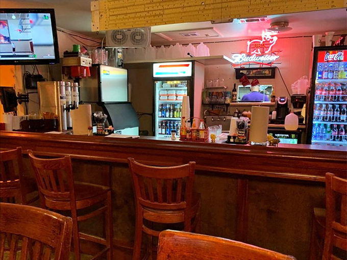 The bar area glows with that welcoming "you've earned this beer" ambiance that makes every barbecue outing feel like a celebration.