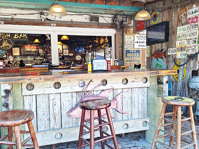 A bar that tells stories through its weathered wood and nautical touches. Each license plate and sign represents someone's "I was here" moment.