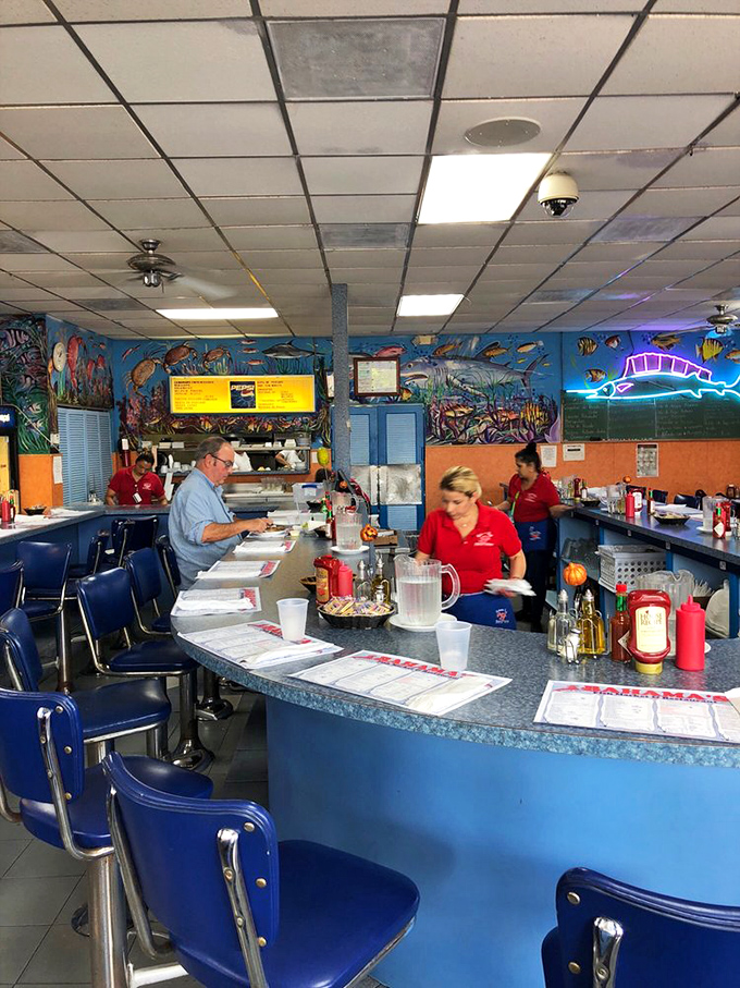 The counter is where regulars perch, servers hustle, and first-timers learn the unspoken rules of authentic seafood appreciation.