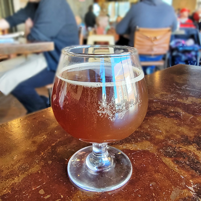 Amber nectar in a proper glass—because craft beer deserves respect. The perfect companion to cut through the richness of everything else on your table.