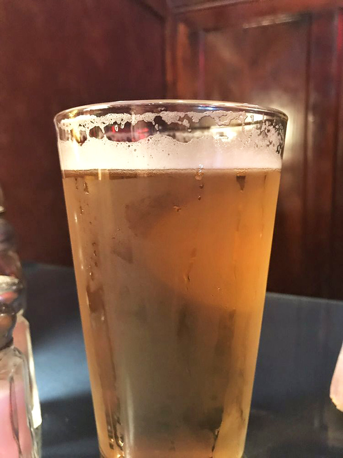 A perfectly poured beer with that satisfying foam collar&mdash;proof that simple pleasures are often the most reliable companions.