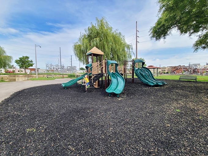 Childhood laughter echoes across this playground where grandparents now bring their grandchildren. Some things in Wapakoneta—like the joy of a good slide—never change.