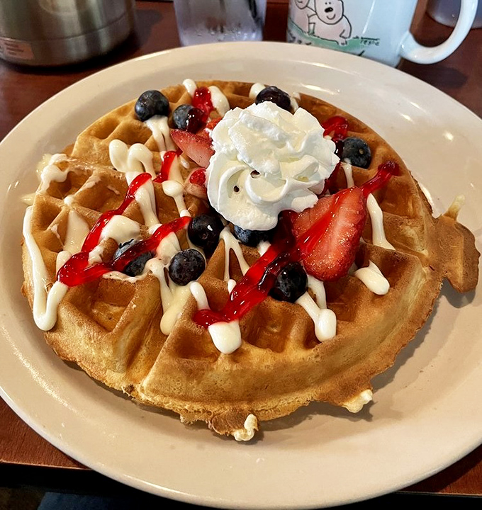 This Belgian waffle, crowned with berries and cream, isn't just breakfast&mdash;it's an event. The kind worth planning your weekend around.