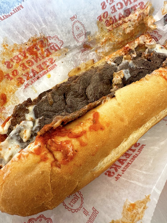 This isn't just lunch—it's a masterpiece of meat, cheese, and bread architecture that would make Rocky himself climb those steps for a bite.