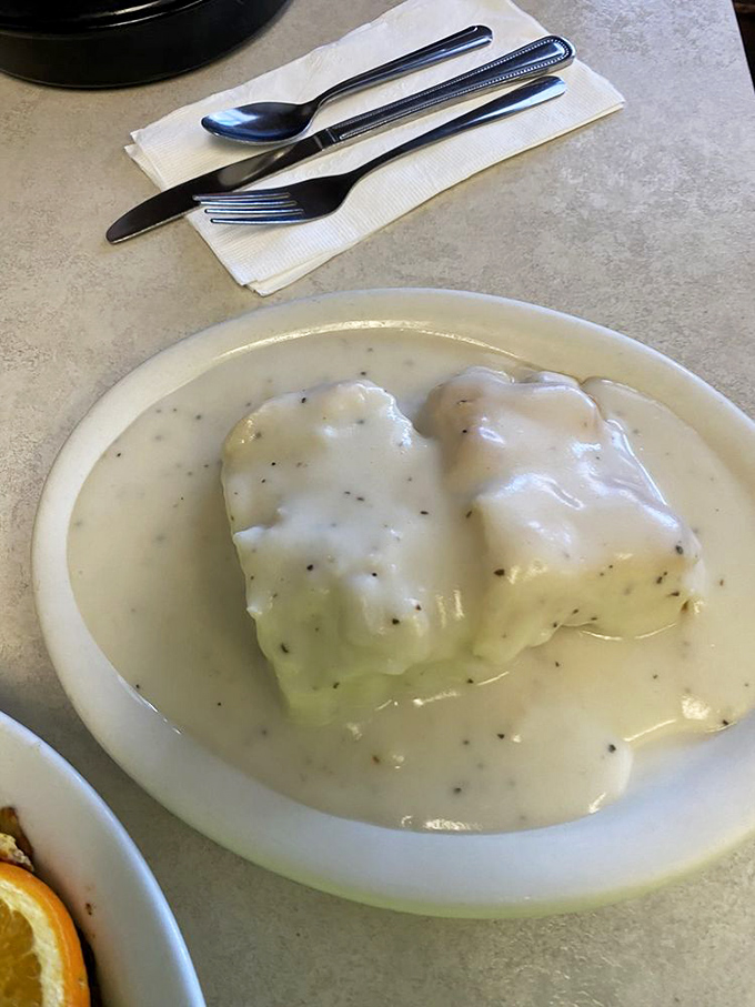Biscuits and gravy that would make your grandmother nod in approval&mdash;pillowy dough islands floating in a sea of peppery cream gravy.