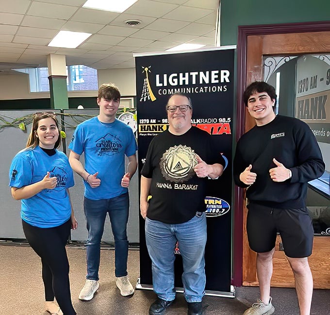 Local radio stations connect the community through music, news, and those "good morning!" voices that become as familiar as family. Plus, everyone's giving a thumbs-up, so things must be good!