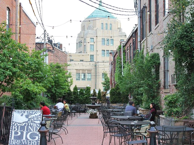 The Blind Pig's courtyard feels like stumbling into a secret garden party where craft beer is the universal language.