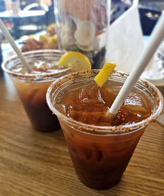 These aren't just drinks; they're liquid companions to your seafood feast, rimmed with spices that complement rather than compete.