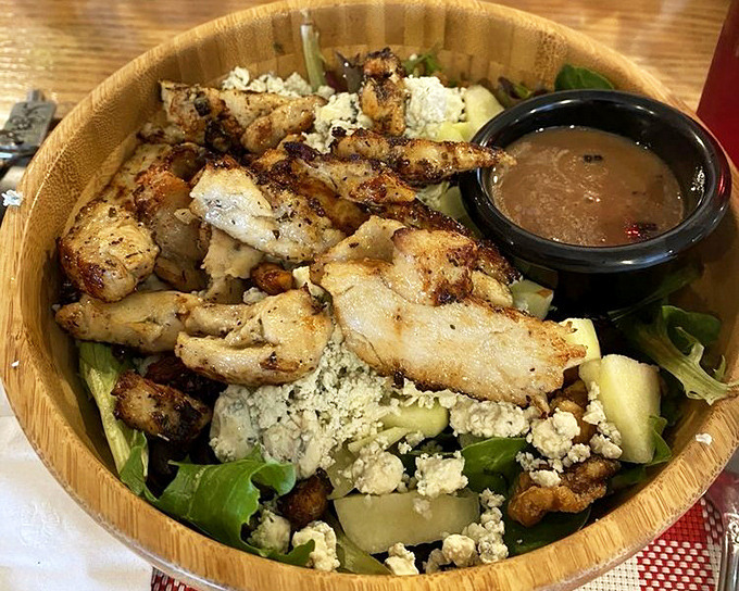 A wooden bowl elevates this chicken and blue cheese salad from lunch to experience. Fresh greens playing the perfect supporting role to perfectly grilled protein.