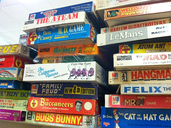 Board games stacked higher than your family's competitive spirit on game night. Monopoly arguments transcend generations!