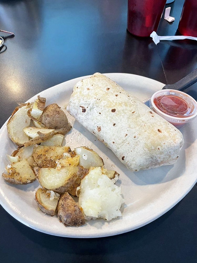 This breakfast burrito isn't messing around—it's a serious morning commitment wrapped in a warm tortilla blanket.