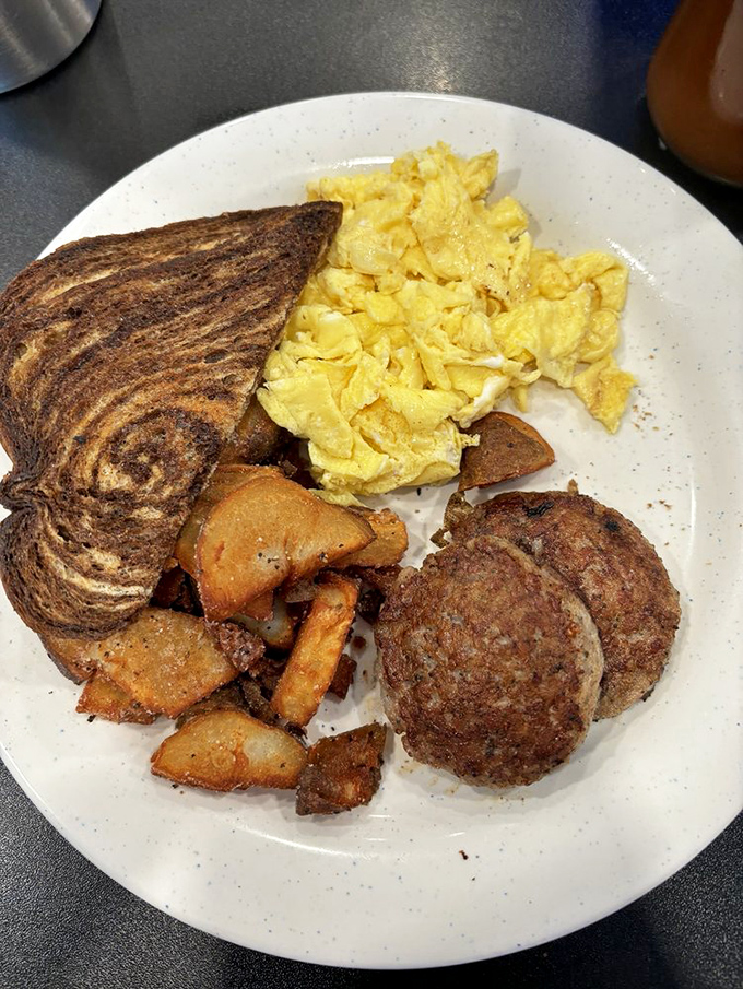 Breakfast democracy in action&mdash;eggs, meat, potatoes, and toast, all getting equal time on the plate and in your heart.