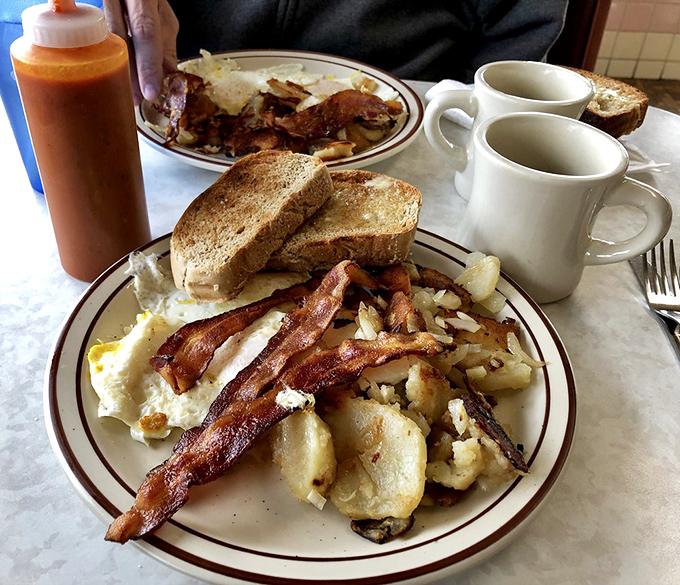 Breakfast of champions&mdash;or anyone with the good sense to appreciate crispy bacon, eggs, and potatoes that haven't forgotten what real butter tastes like.