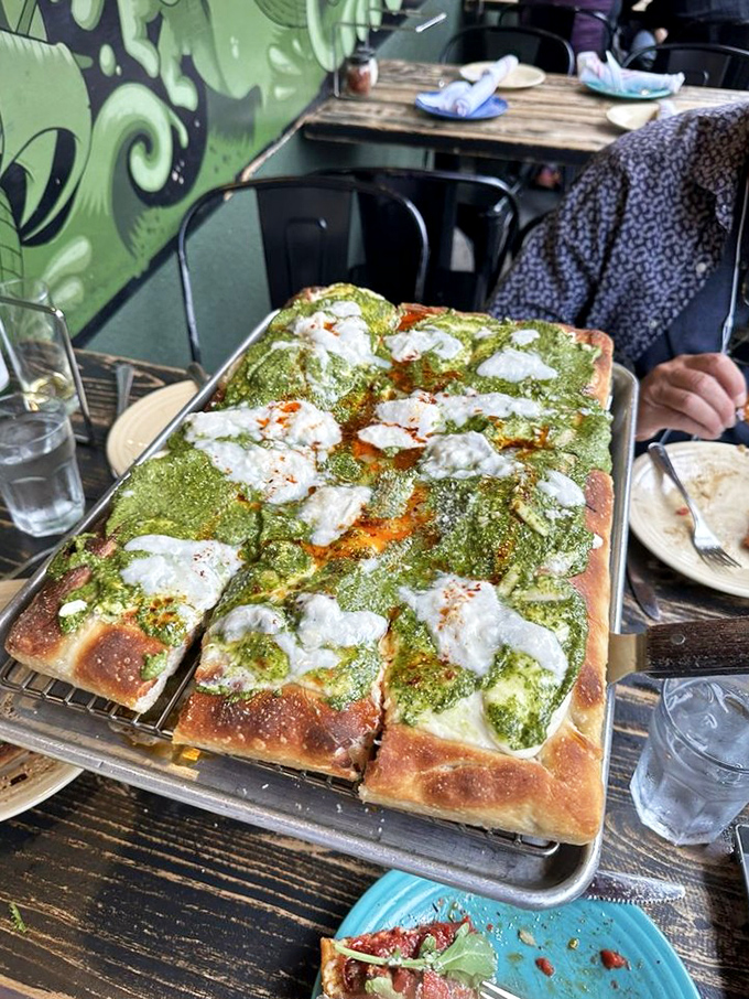 Not all heroes wear capes&mdash;some come covered in vibrant pesto, dotted with creamy cheese islands that melt into a sea of flavor.