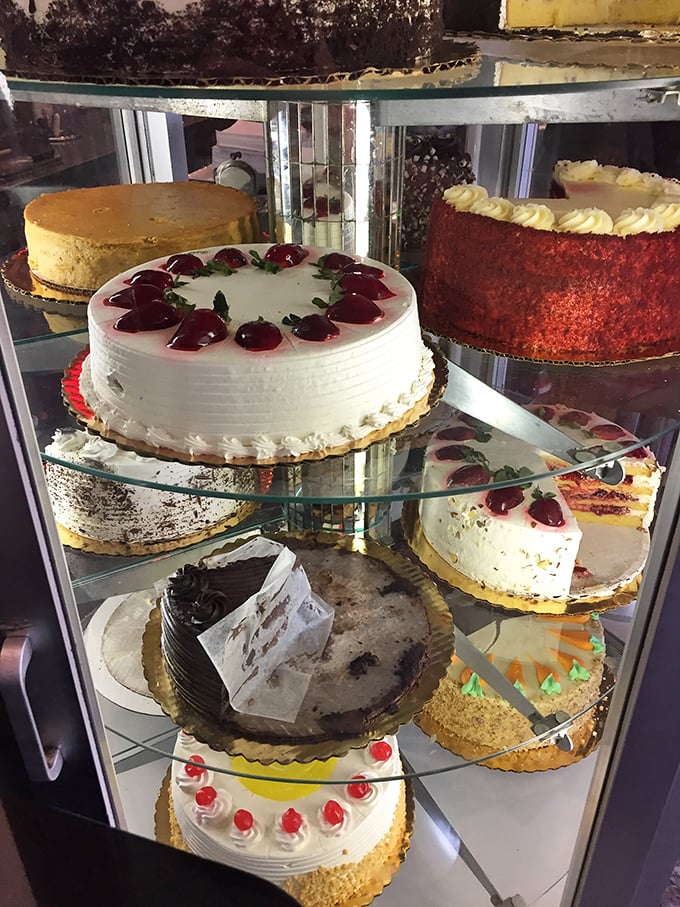 The dessert case&mdash;where willpower goes to die and celebrations begin. Each cake a monument to the sweet life.
