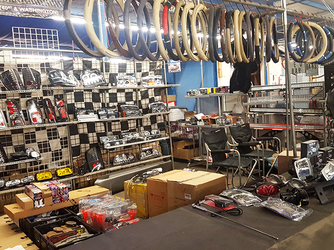 A gearhead's dream corner. Steering wheels, car accessories, and parts organized with the precision of an automotive surgeon's toolkit.