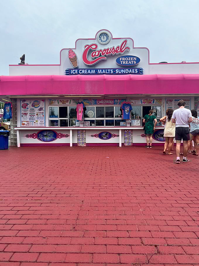 Carousel's pink facade promises the kind of ice cream experience that makes adults temporarily forget about things like cholesterol and dignity.