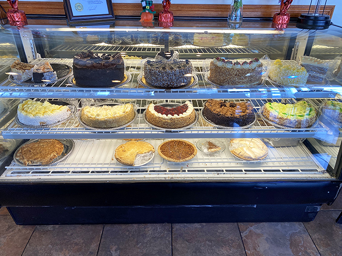 The dessert case stands as a monument to willpower—each pie and cake silently arguing why calories shouldn't count when they taste this good.