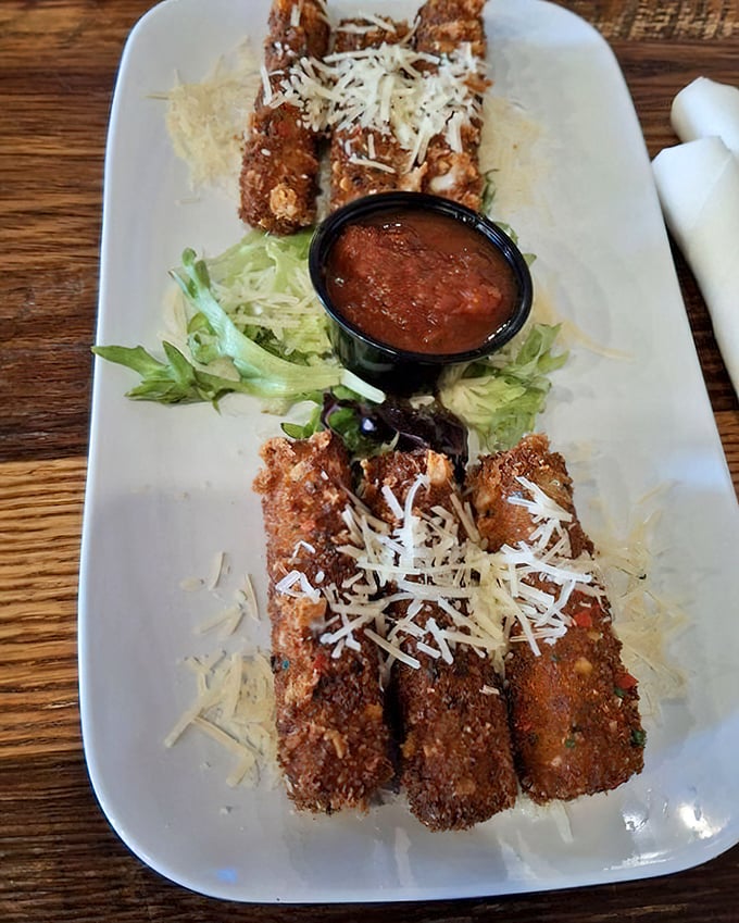 These aren't your average mozzarella sticks&mdash;they're golden-brown, cheese-filled torpedoes of happiness, dusted with parmesan and served with marinara for dipping.