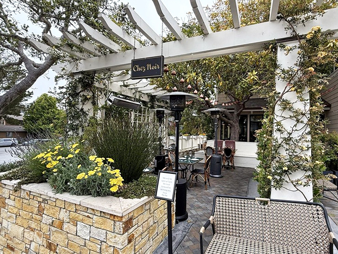 Dining under a pergola at Chez Noir feels like you've discovered the secret garden party that all the cool locals have been keeping to themselves.