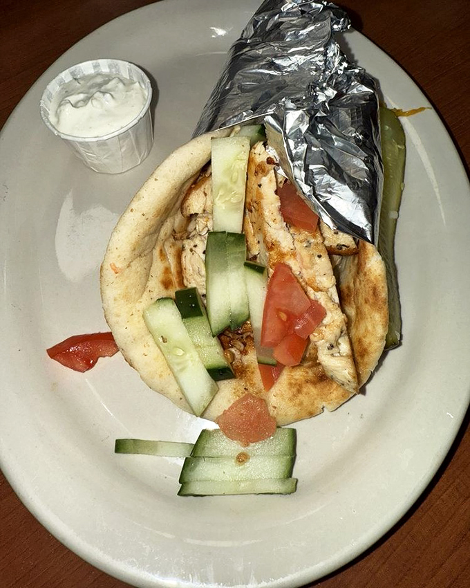 A chicken gyro that respects tradition while satisfying American-sized appetites. That tzatziki sauce deserves its own fan club.