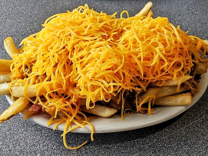 Chili cheese fries that laugh in the face of diet plans&mdash;a glorious mess of crispy potatoes, savory chili, and that unmistakable cheese.