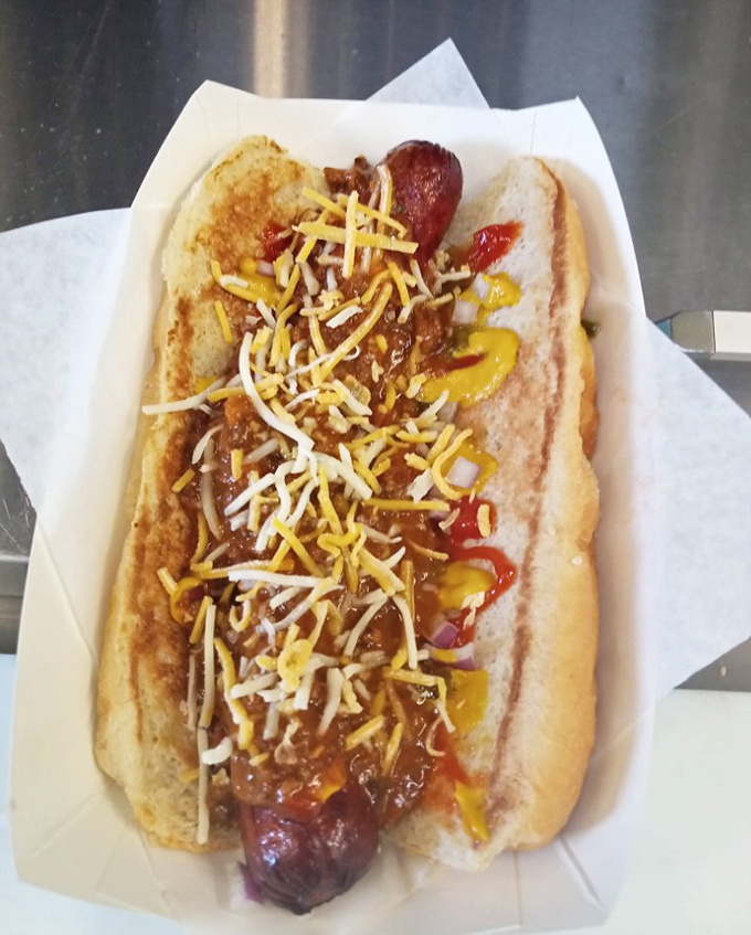 Not just any chili dog—this is a masterpiece of beef, cheese, and chili that would make even the most dignified person lick their fingers.