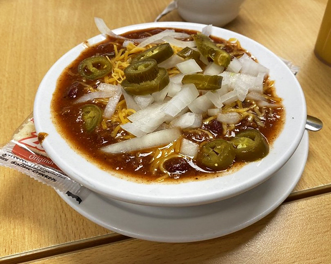 Chili that's worth the sweat! Topped with jalape&ntilde;os, cheese, and onions, this bowl brings the heat and the heart.