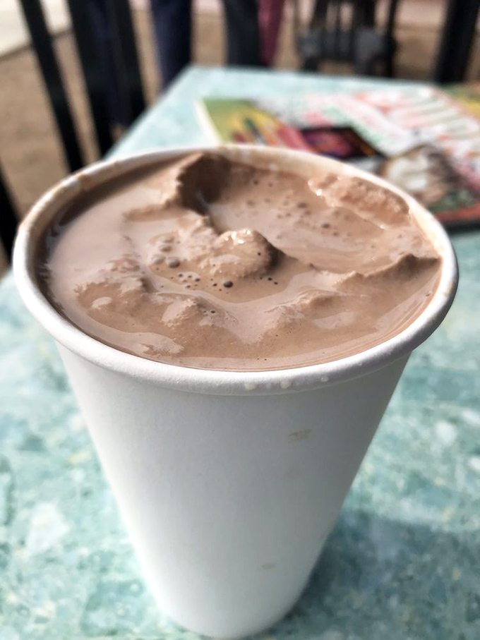 A chocolate shake thick enough to bend physics and straws alike. Patience yields the sweetest rewards.