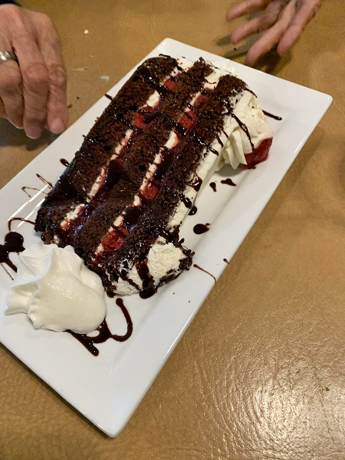 This Black Forest cake isn't just dessert, it's therapy—layers of chocolate, cream, and cherries that make you forget whatever diet you were considering.