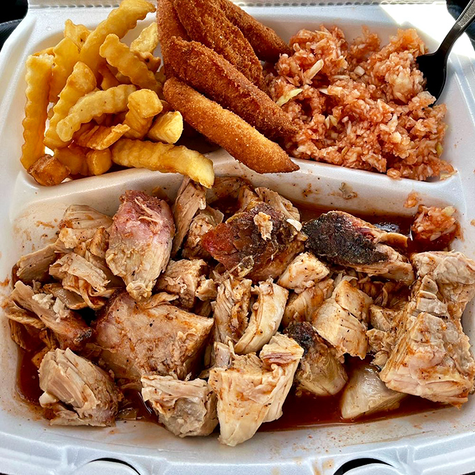The barbecue plate that answers the eternal question: "Why choose between sides when you can have them all?" Meat and three, North Carolina style.