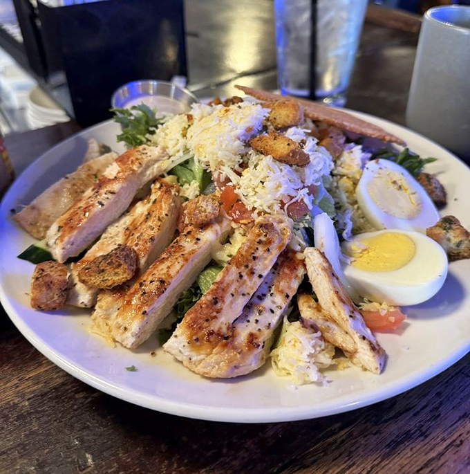 Fresh greens meet hearty toppings in a salad that proves healthy eating doesn't mean sacrificing flavor or satisfaction.