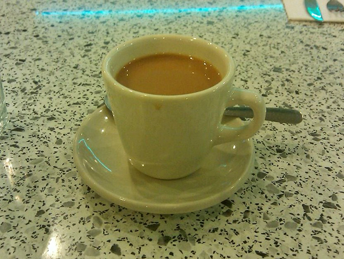 Coffee served in a classic diner mug&mdash;the kind that feels like it's been warming hands and hearts since the Eisenhower administration.