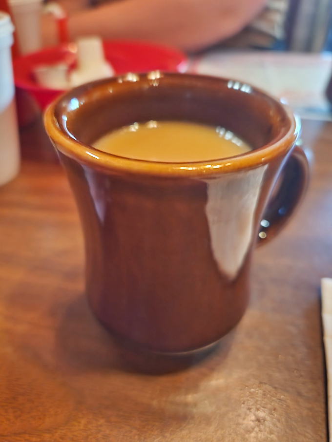 Coffee served in a sturdy brown mug that feels like it's been in your hand a thousand times before&mdash;familiar, comforting, and ready for refills.