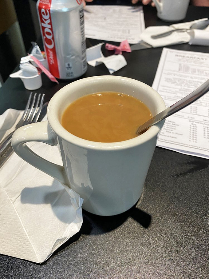 That perfect diner coffee moment&mdash;slightly worn menu in the background, creamy brew in the foreground, and endless possibilities in between.