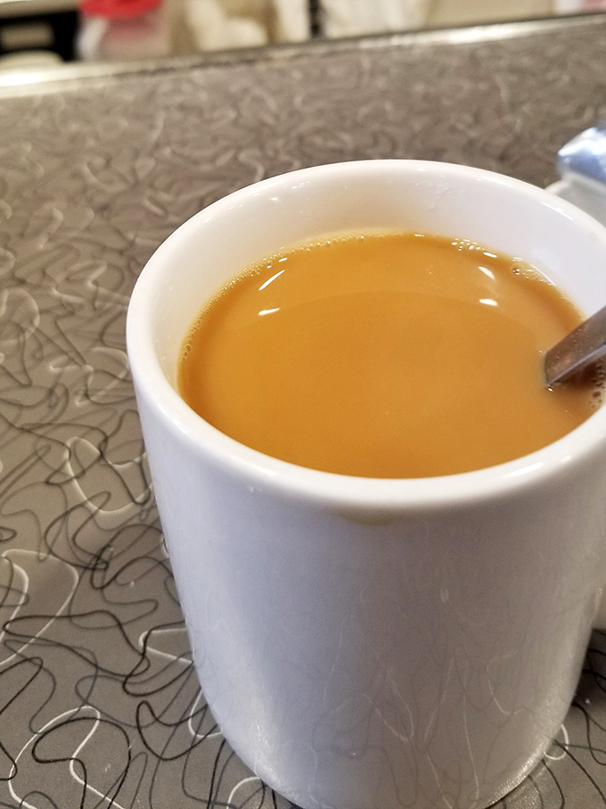 Coffee served in classic diner mugs, because some traditions are too perfect to mess with or improve upon.