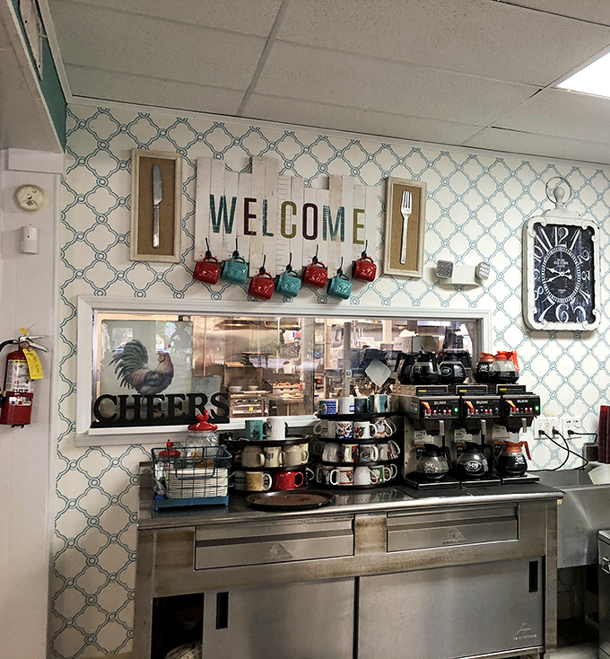 The coffee station stands ready for battle, armed with colorful mugs and the promise of perfect morning fuel.