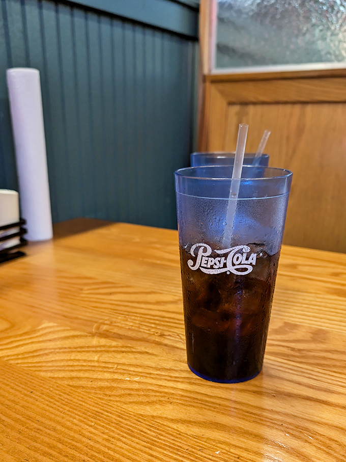 That blue Pepsi glass isn't just holding soda&mdash;it's preserving a tradition of proper Southern sweet tea service that pairs perfectly with smoky meats.